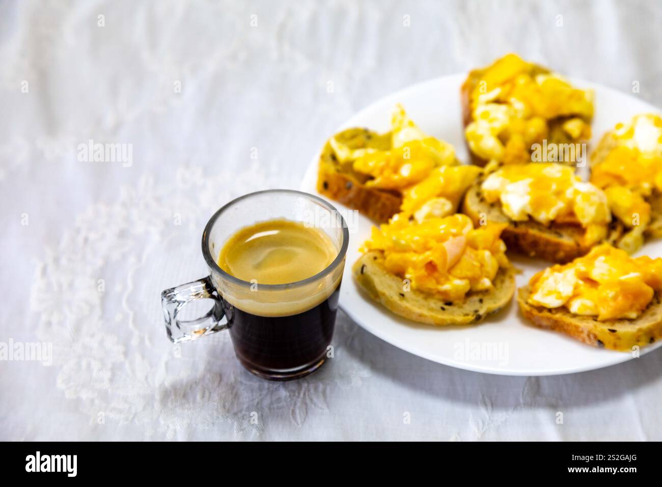 A minimalist breakfast classic, bread, scrambled eggs and coffee Stock ...