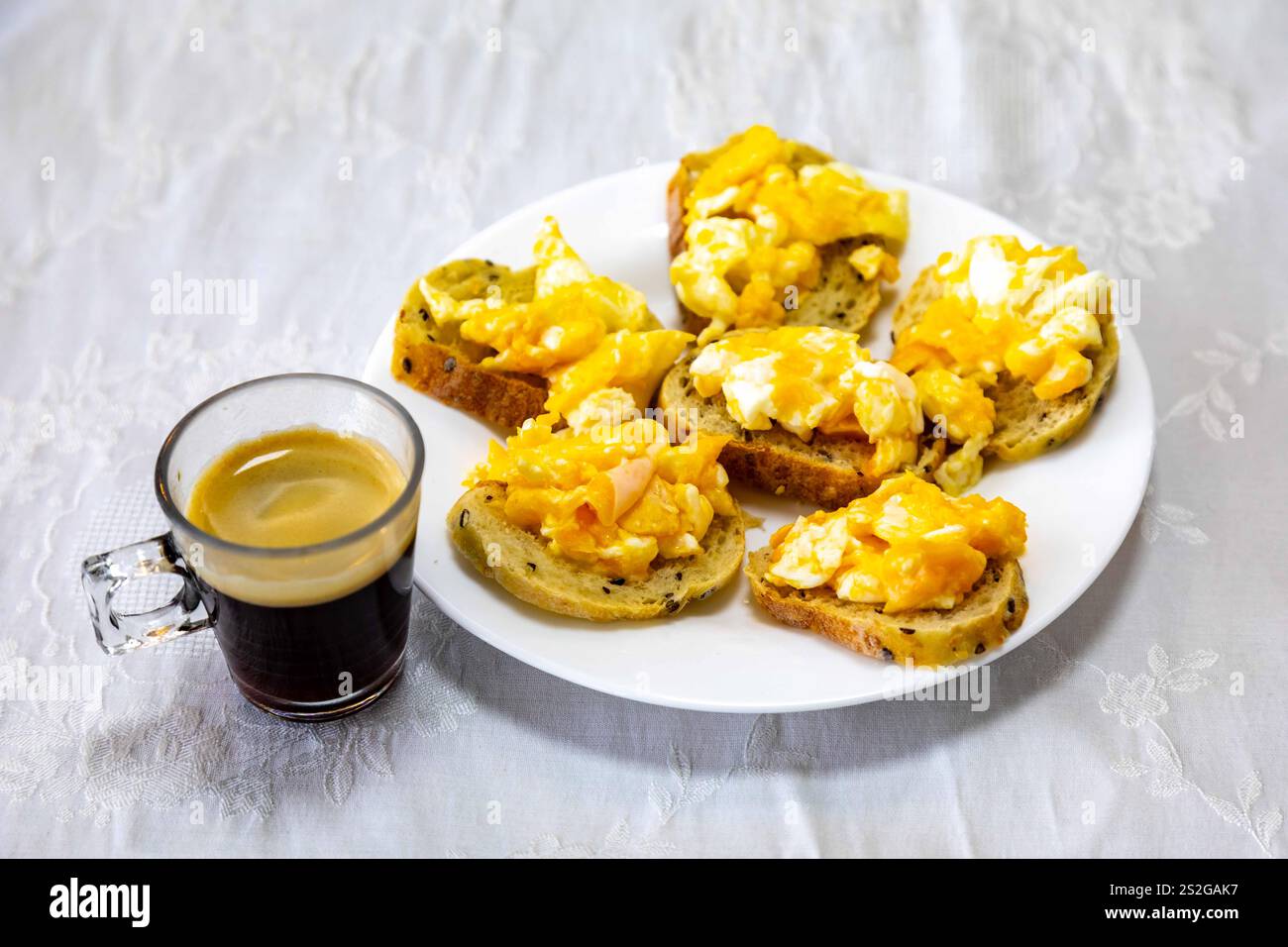 A minimalist breakfast classic, bread, scrambled eggs and coffee Stock ...