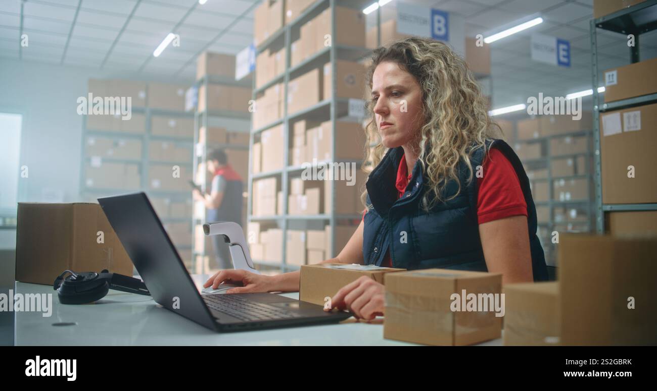 Female manager scans parcel using hi-res stock photography and images ...