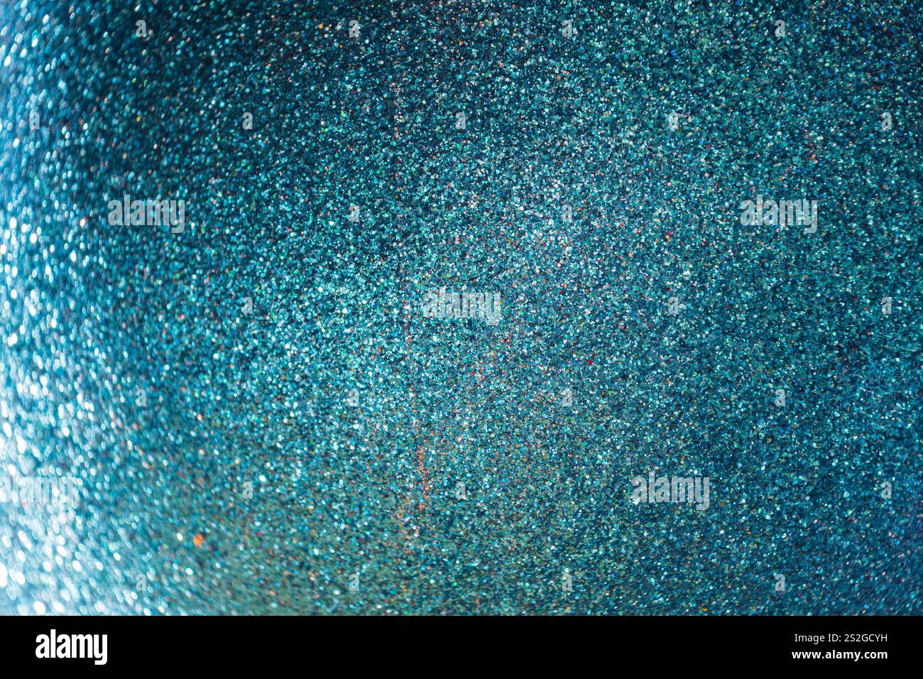 A close-up view of a shimmering blue surface, densely packed with fine ...