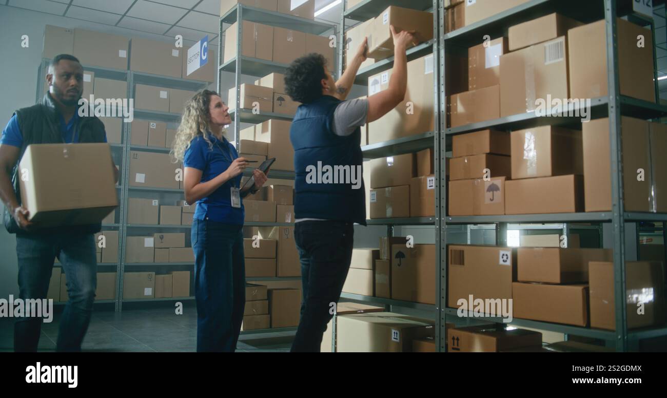 Female warehouse associate scans cardboard hi-res stock photography and ...