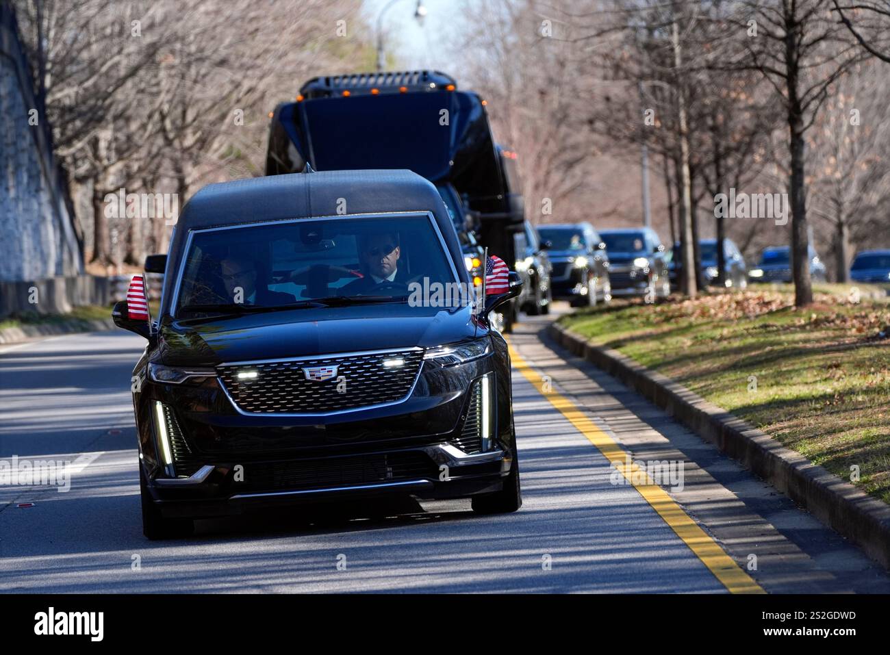 The motorcade carrying the casket of former President Jimmy Carter ...
