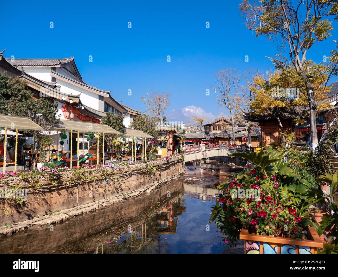 Ancient village along the canal with stone bridge crossing over with ...