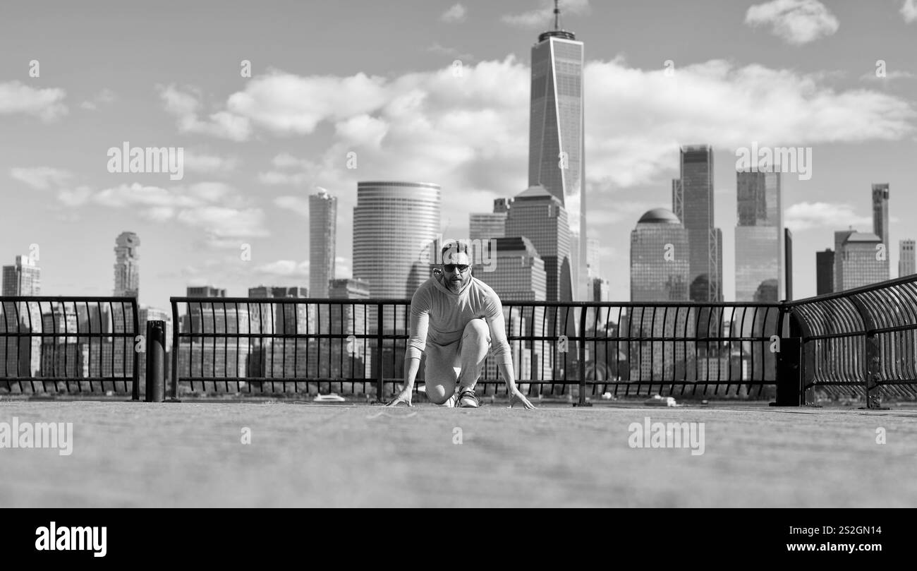 Athlete man ready for competition in running start pose in New York ...
