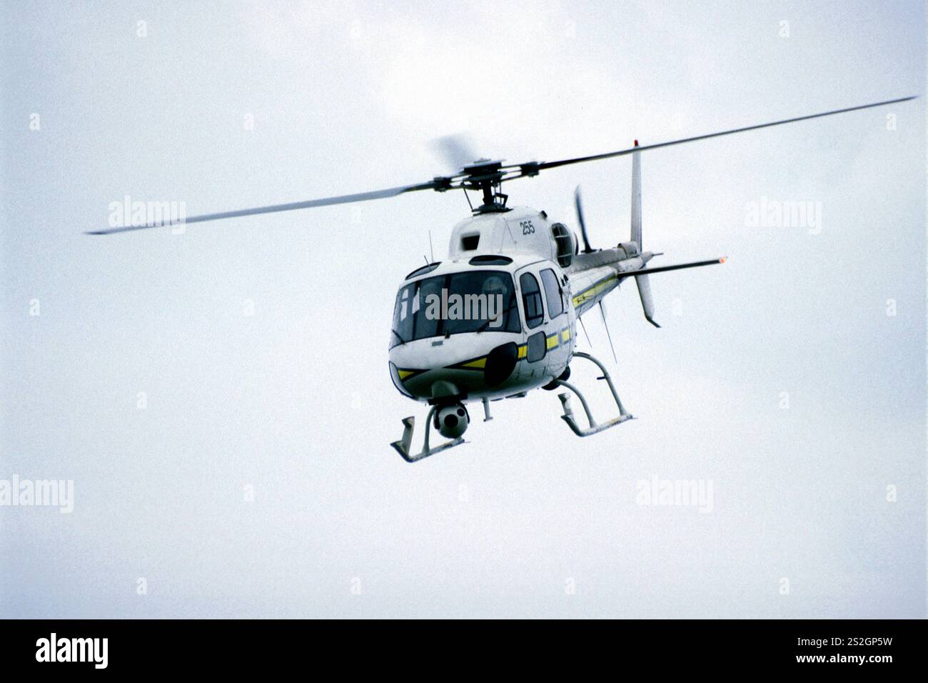Police helicopter in flight. The Helicopter has a FLIR ,Forward Looking ...