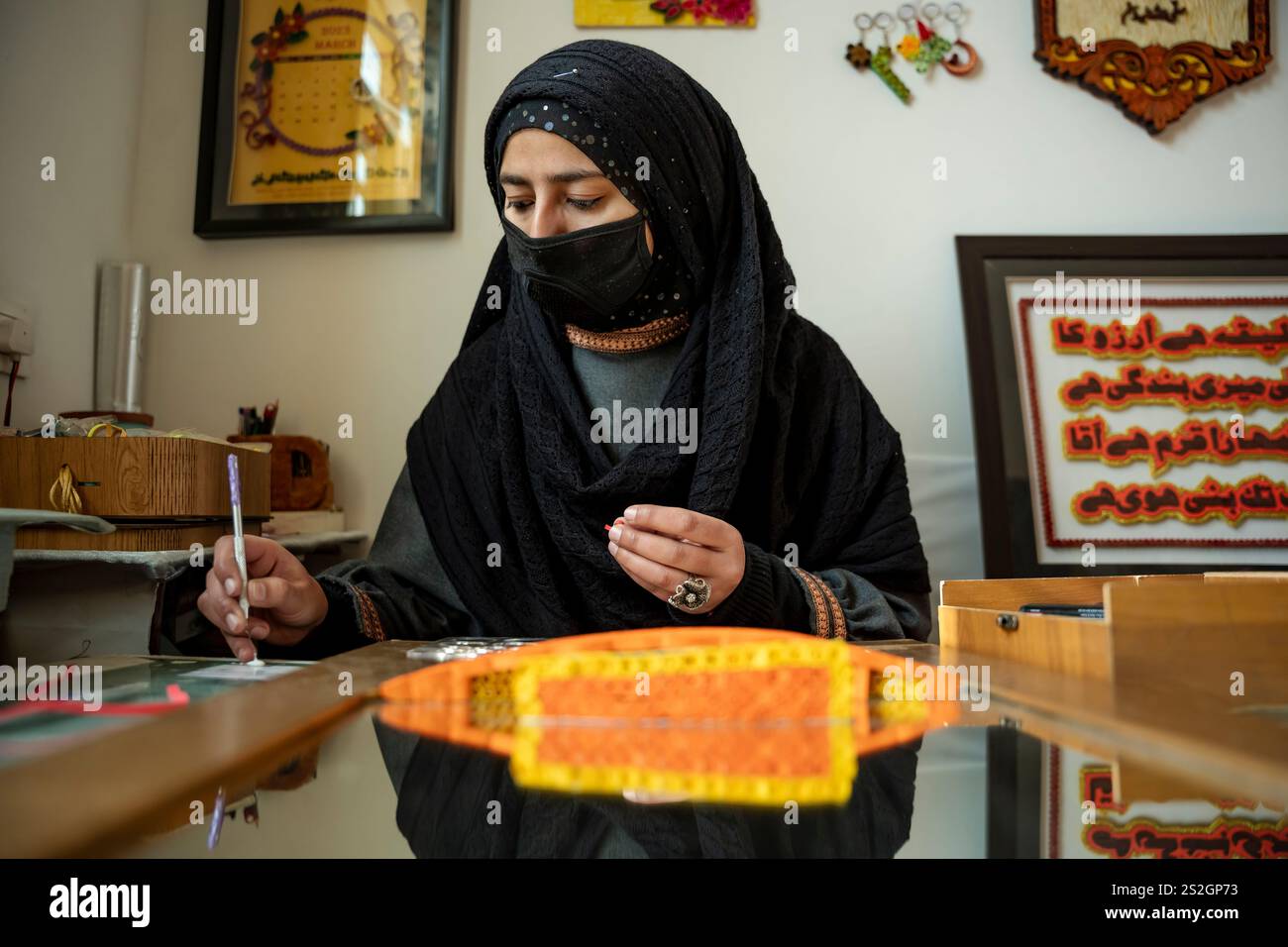 Sabreena Aaliya works with quilling paper to create intricate designs ...