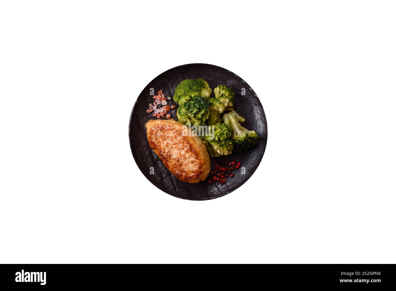 Delicious fresh green broccoli steamed in a ceramic plate on a white ...