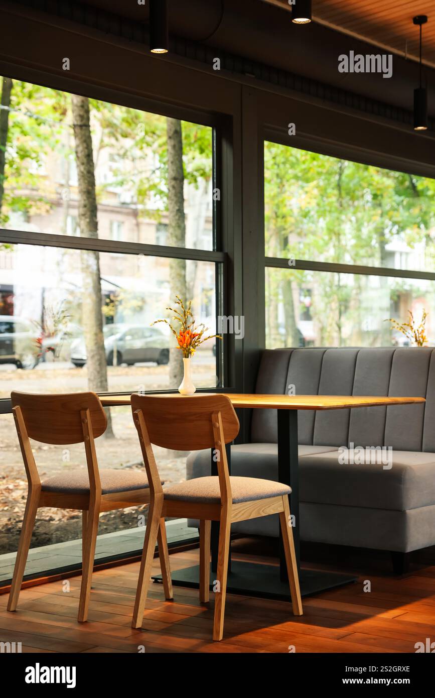 Stylish cafe with large windows. Interior design Stock Photo - Alamy