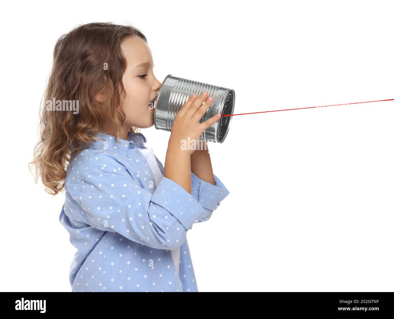 Girl using tin can telephone on white background Stock Photo - Alamy