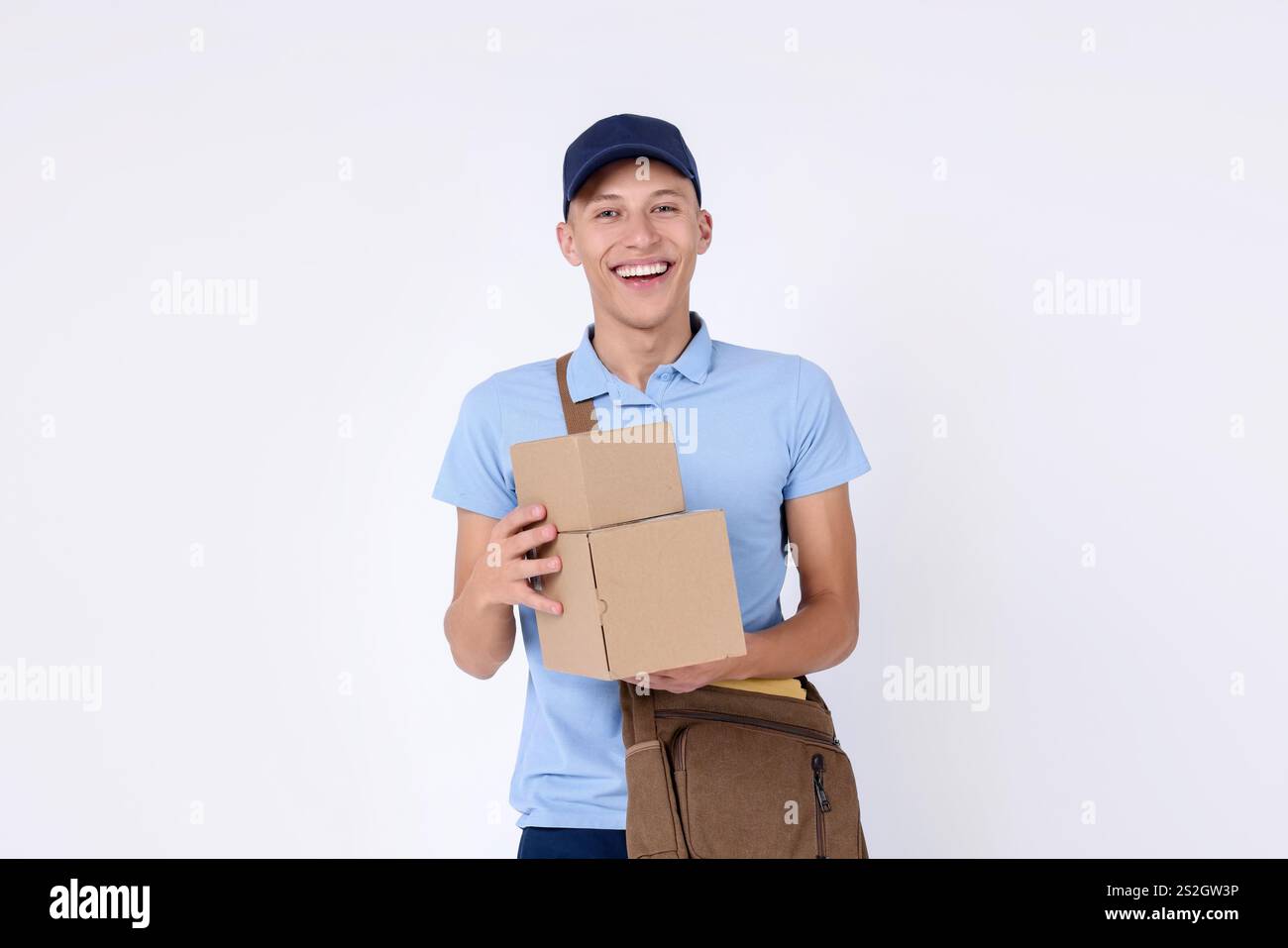 Happy postman with bag and parcels on white background Stock Photo - Alamy