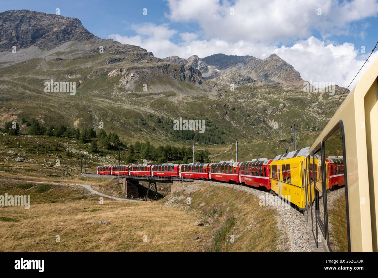 The Bernina Express through the Swiss Alps Stock Photo - Alamy