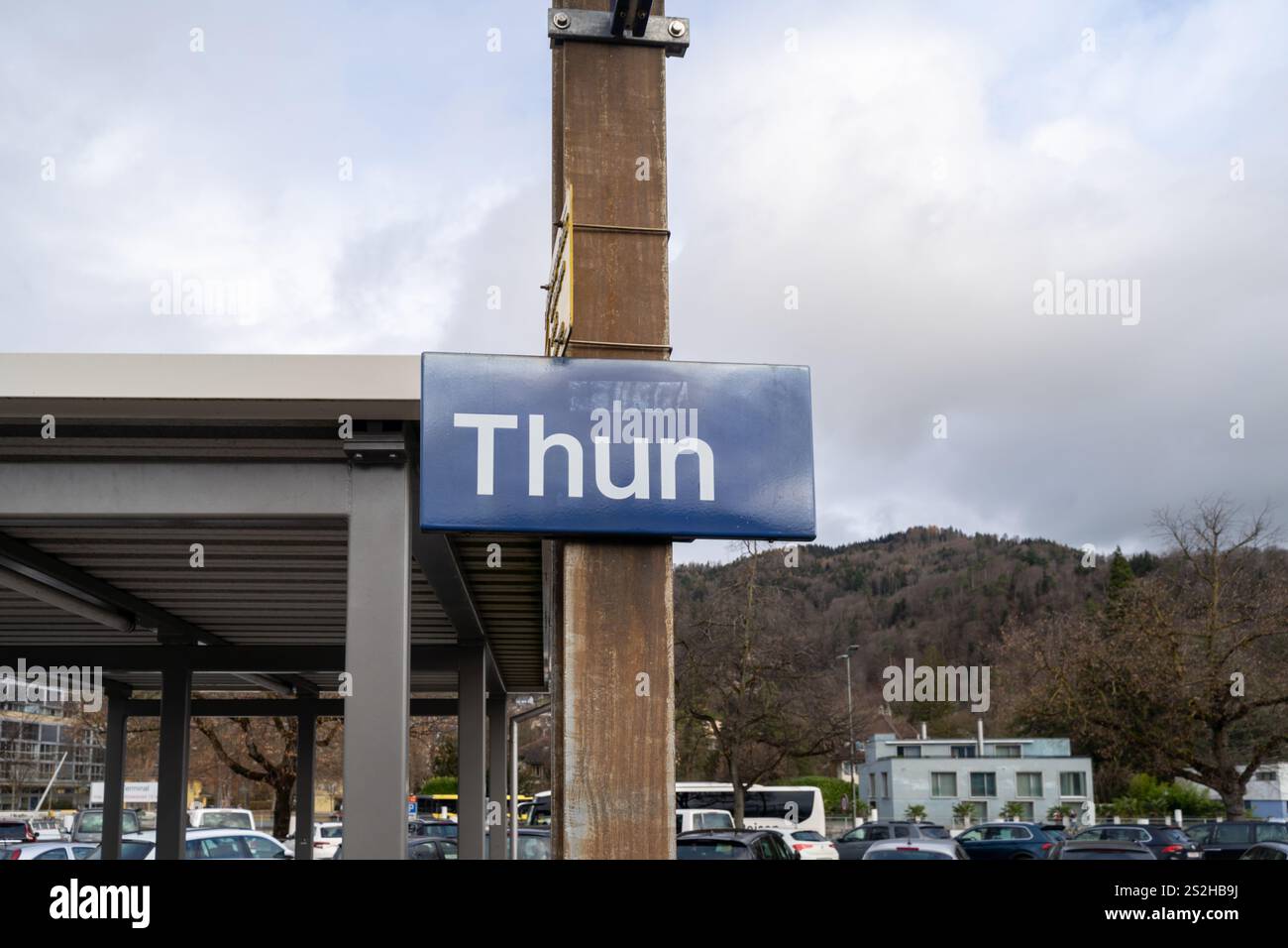 Train station platform sign for Thun Switzerland stop Stock Photo - Alamy