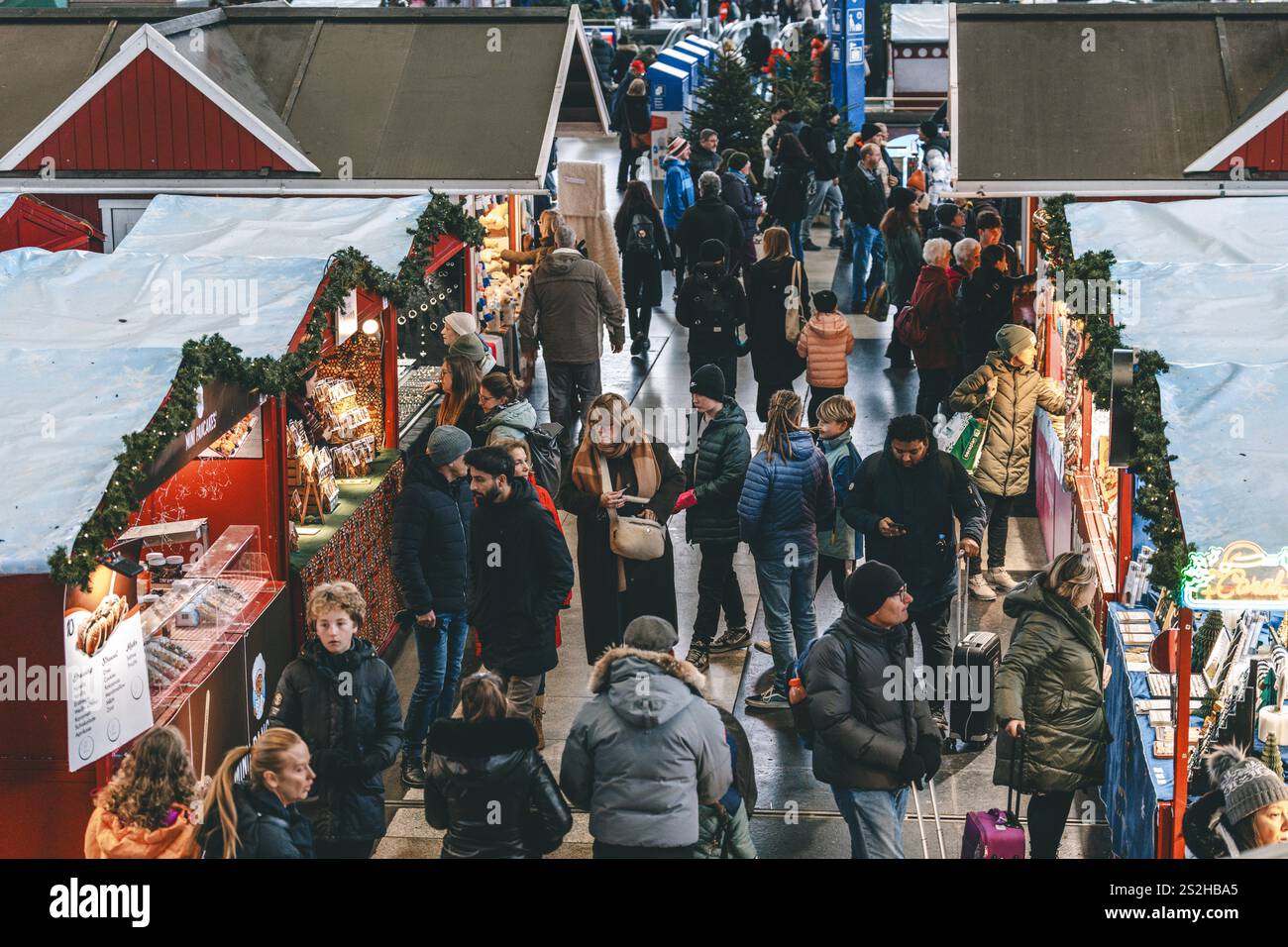 Zurich, Switzerland - December 8, 2024: Booths at the busy Zurich train ...