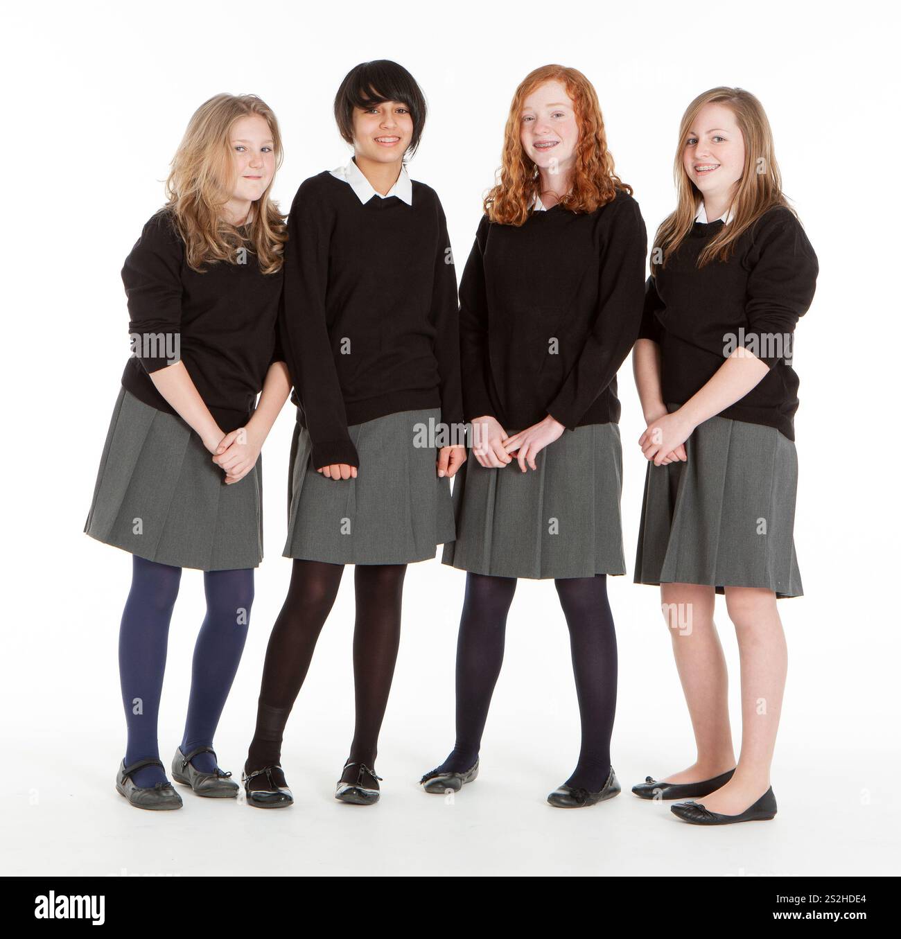 Early Teenage Students: Girl Friends. A small group of smiling early ...