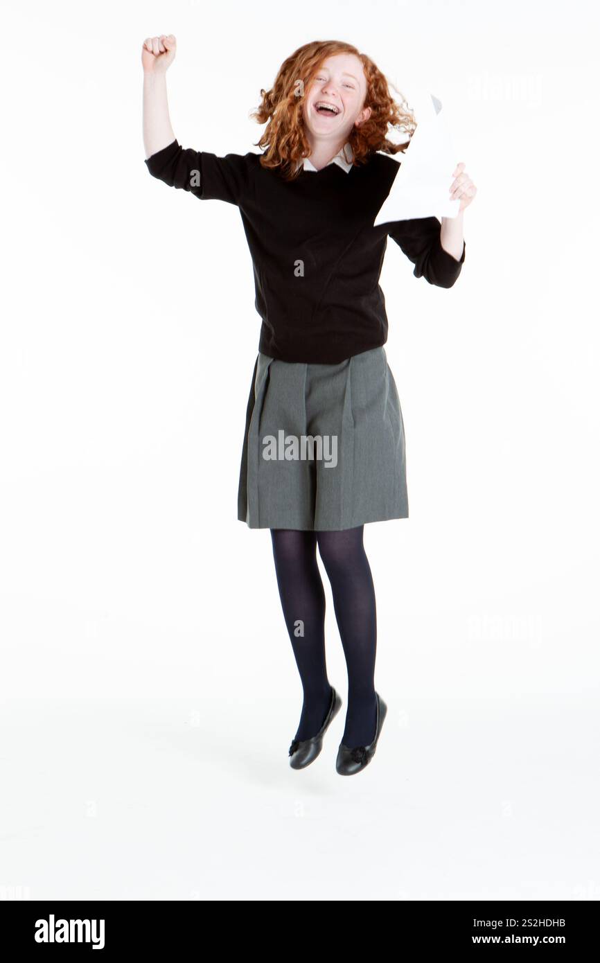 Early Teenage Students: Top Marks. An early teenage girl in school ...