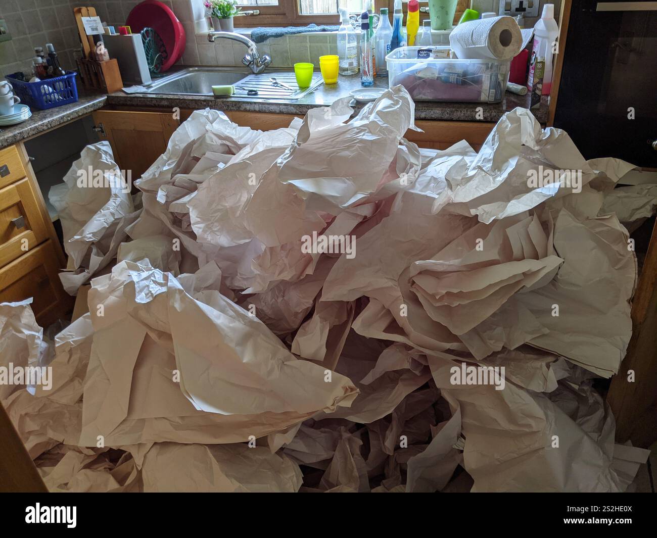 pile of wrapping paper in kitchen during Stock Photo - Alamy
