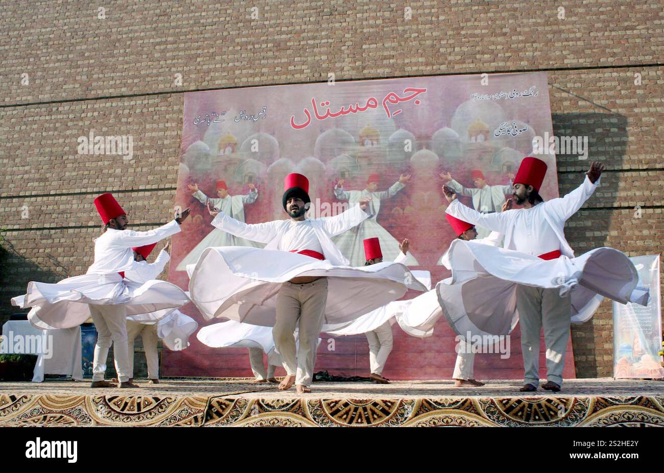 Sufi artists perform on stage on the occasion of Punjab Sufi Festival organized by Auqaf and ...
