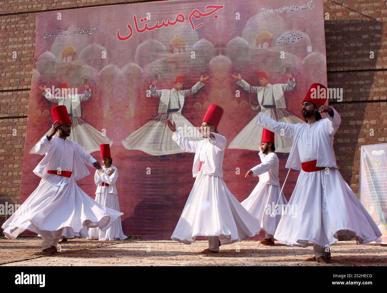 Sufi artists perform on stage on the occasion of Punjab Sufi Festival organized by Auqaf and ...