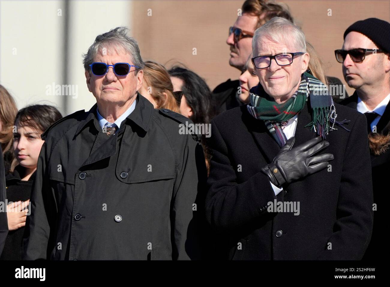 James "Chip" Carter and Jack Carter watch as the flag-draped casket of ...
