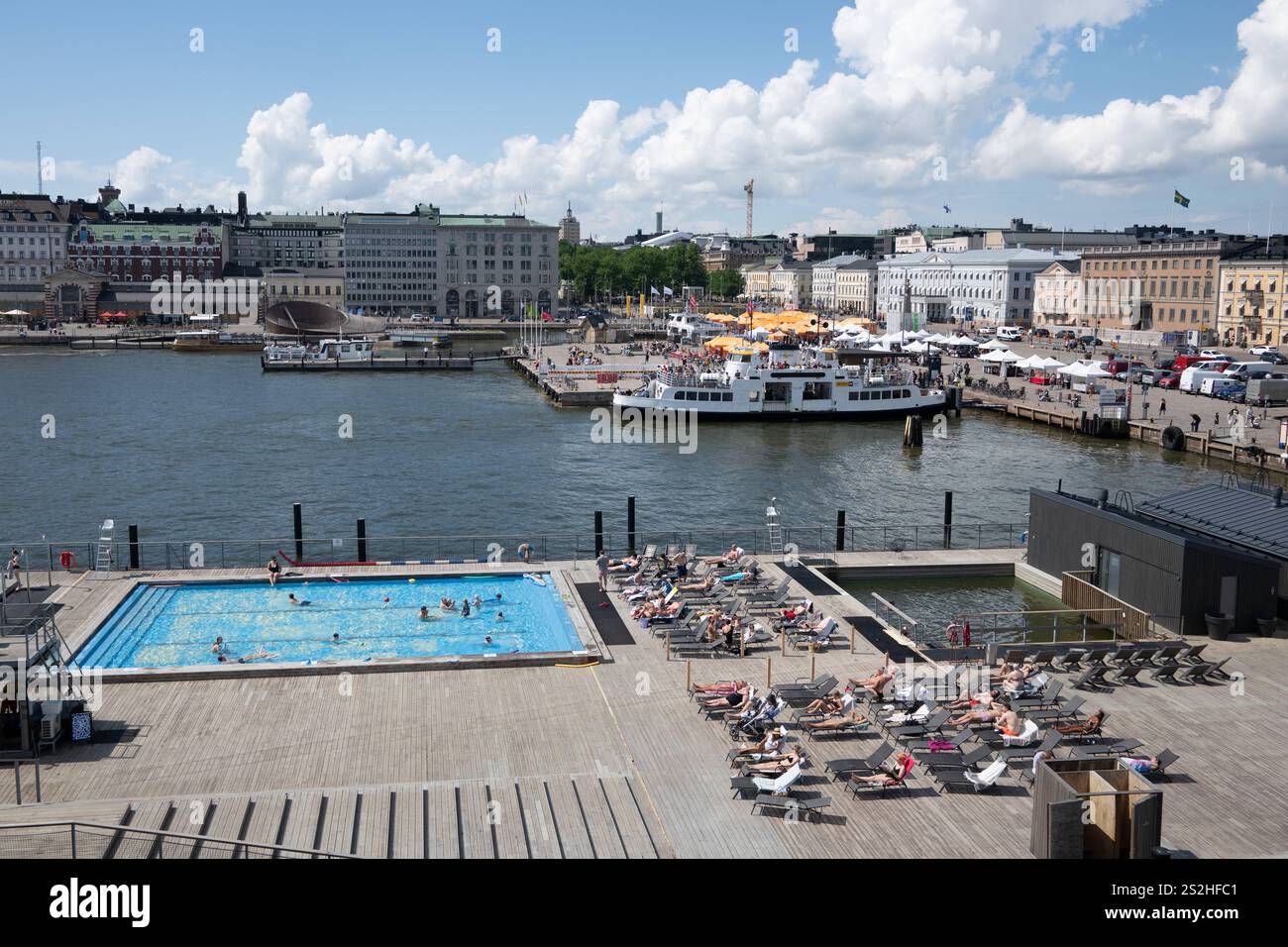 Helsinki, Finland. 02nd June, 2024. Bathers lie in front of a swimming ...