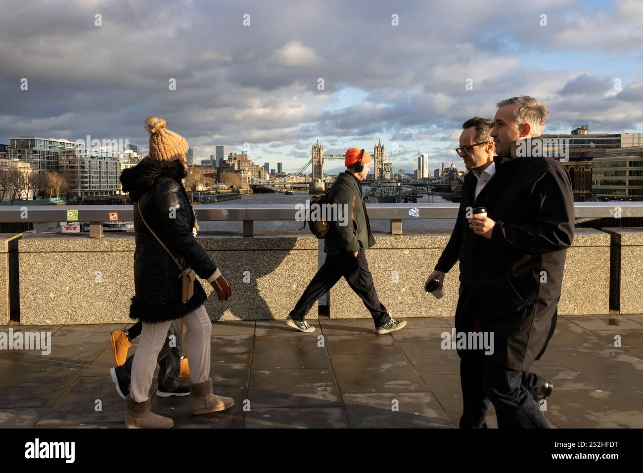 Commuters in the late afternoon winter sunshine on London Bridge after ...
