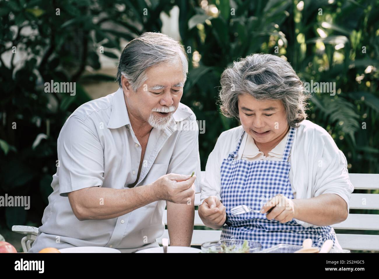 Elderly couples Cooking Healthy food together Stock Photo - Alamy