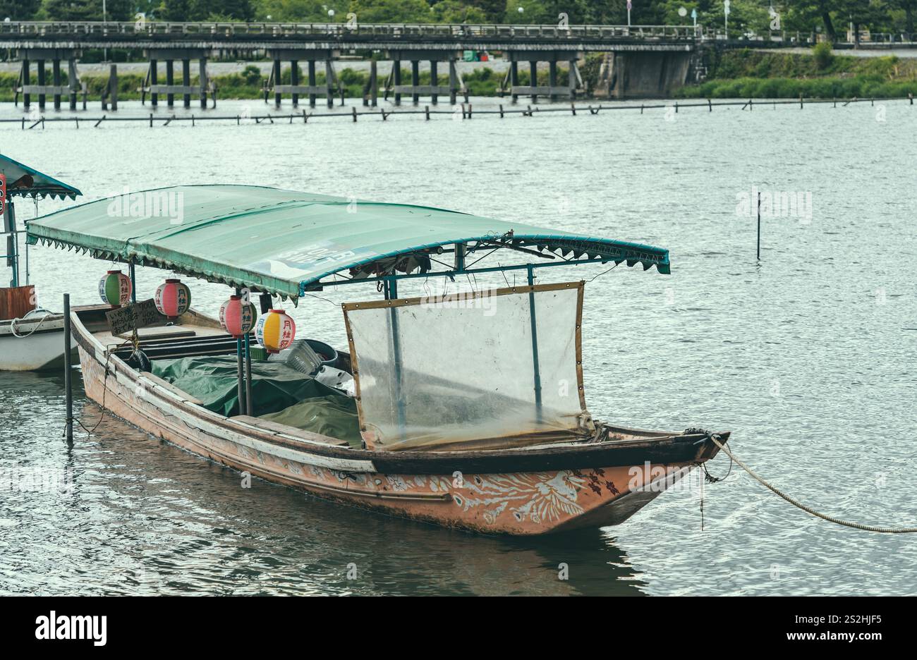 Scenic landscape from Arashiyama with japanese boats at the dock on ...