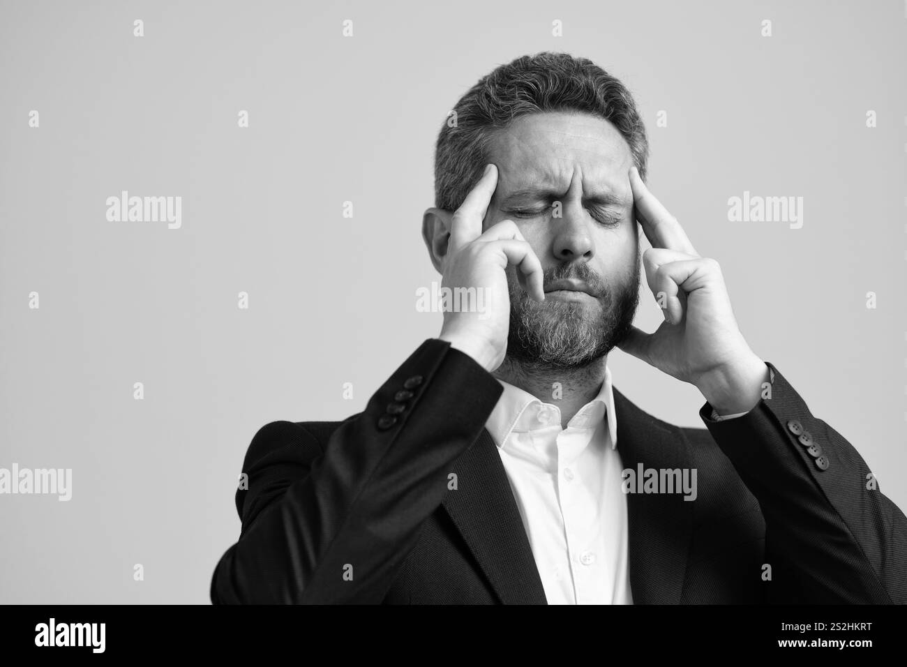 Businessman with stress and burnout. Business man got migraine touch ...