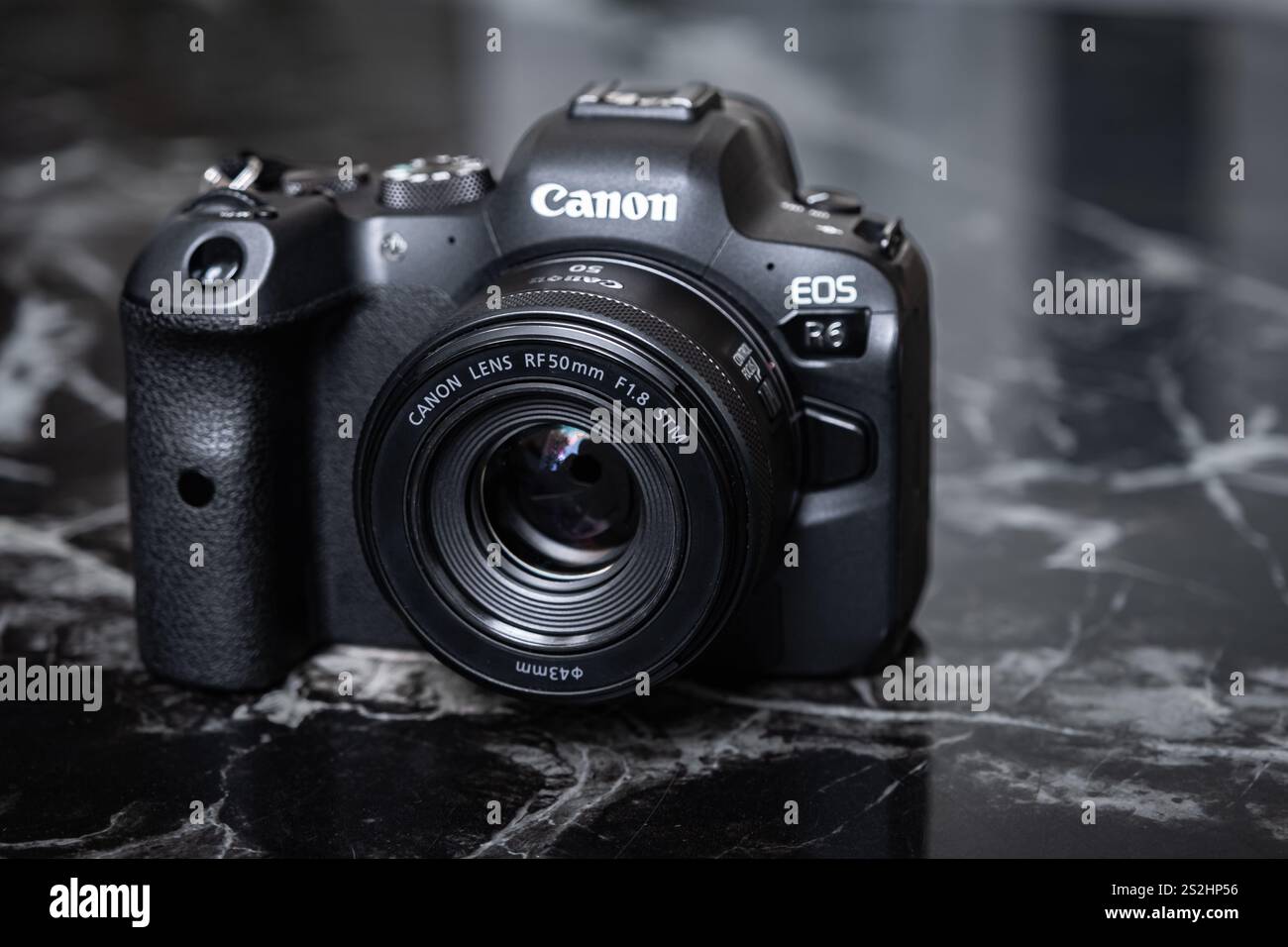 Modern digital mirrorless camera. Canon's new mirrorless camera close-up. Mirrorless Camera ...