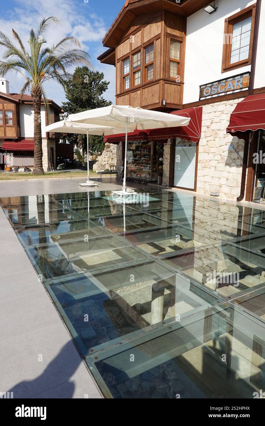Modern shops built over visible ancient city Stock Photo - Alamy