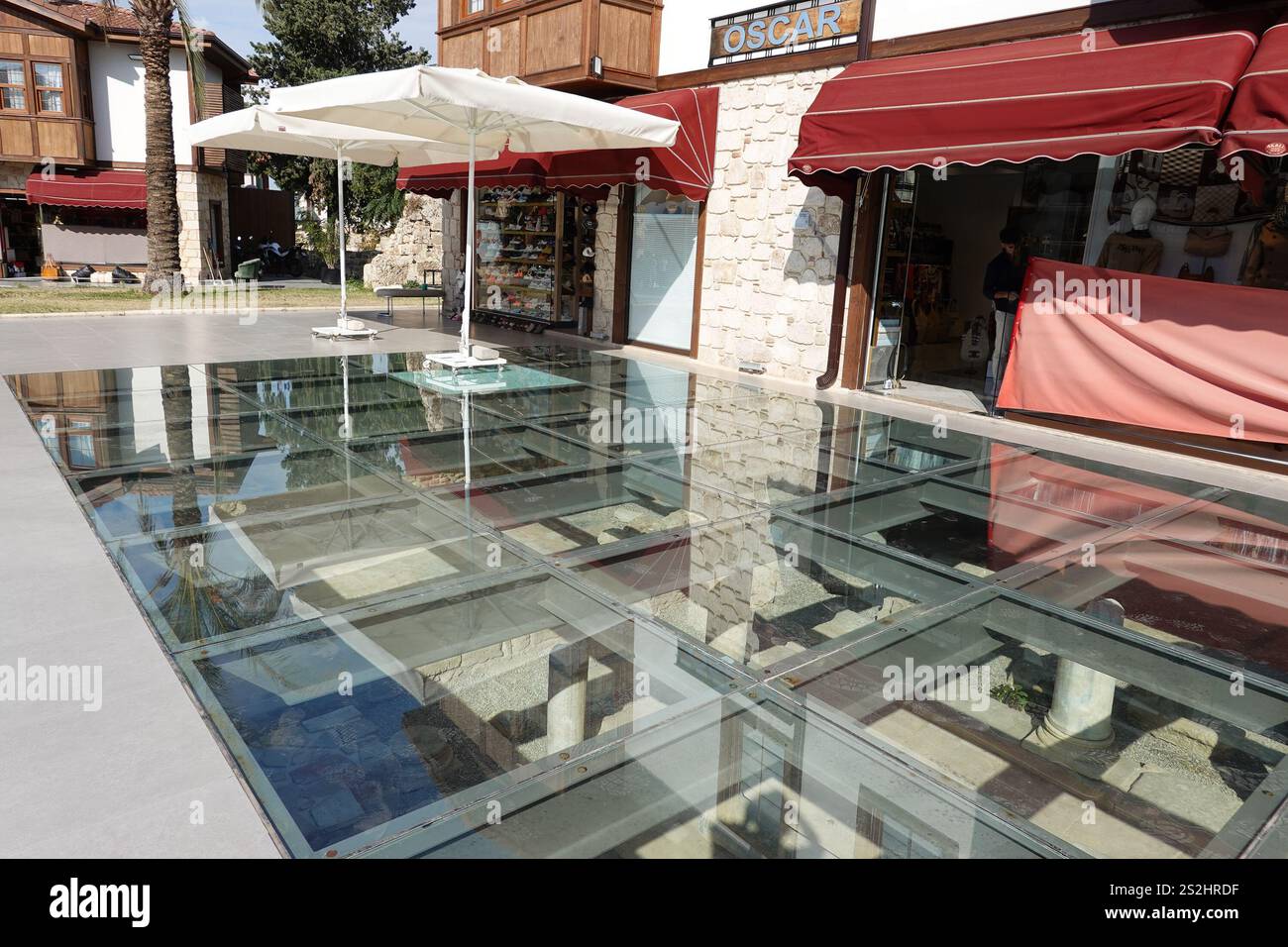 Modern shops built over visible ancient city Stock Photo - Alamy