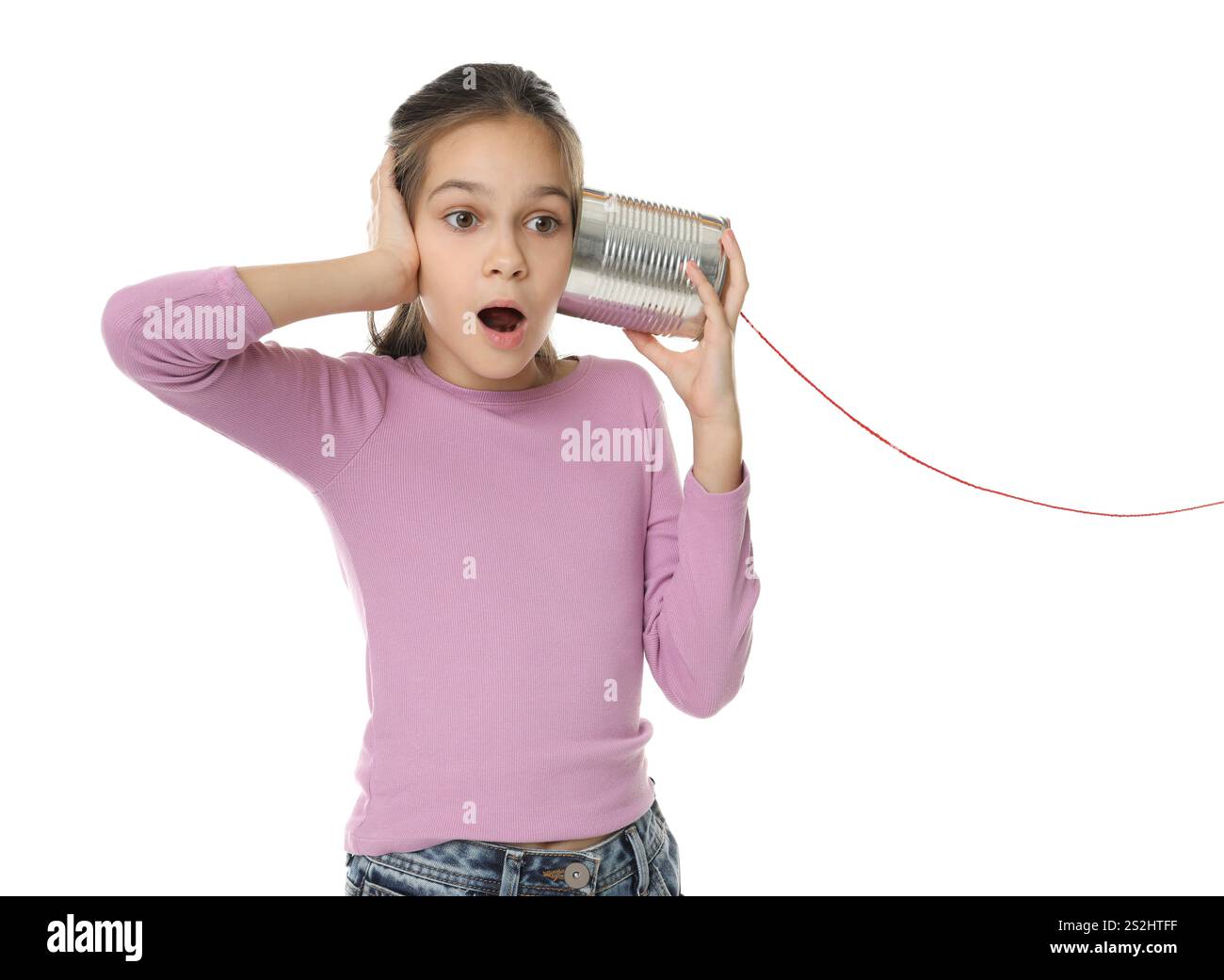 Girl using tin can telephone on white background Stock Photo - Alamy