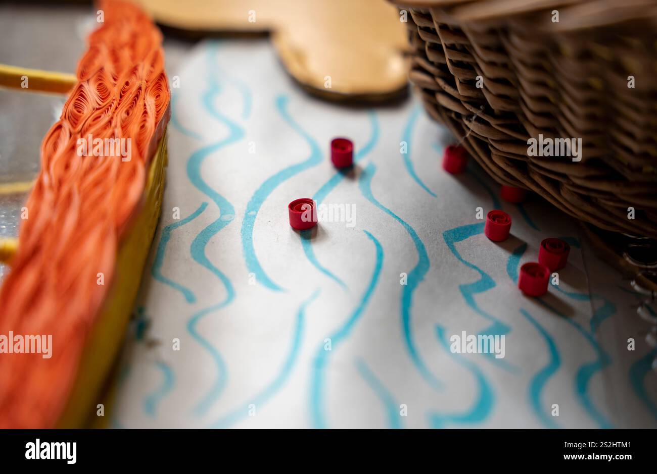Designs crafted from quilling paper is seen at a home-based workplace ...