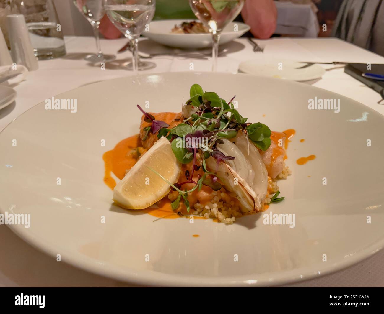 Exquisite gourmet dishes elegantly presented in a fine dining restaurant. Luxurious ingredients ...