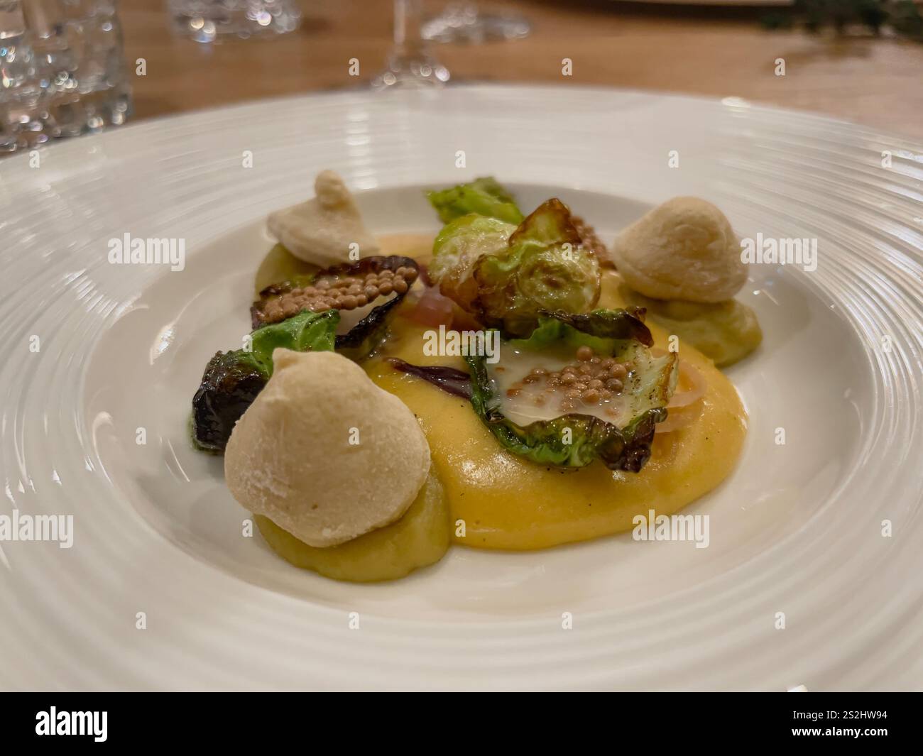 Exquisite gourmet dishes elegantly presented in a fine dining ...