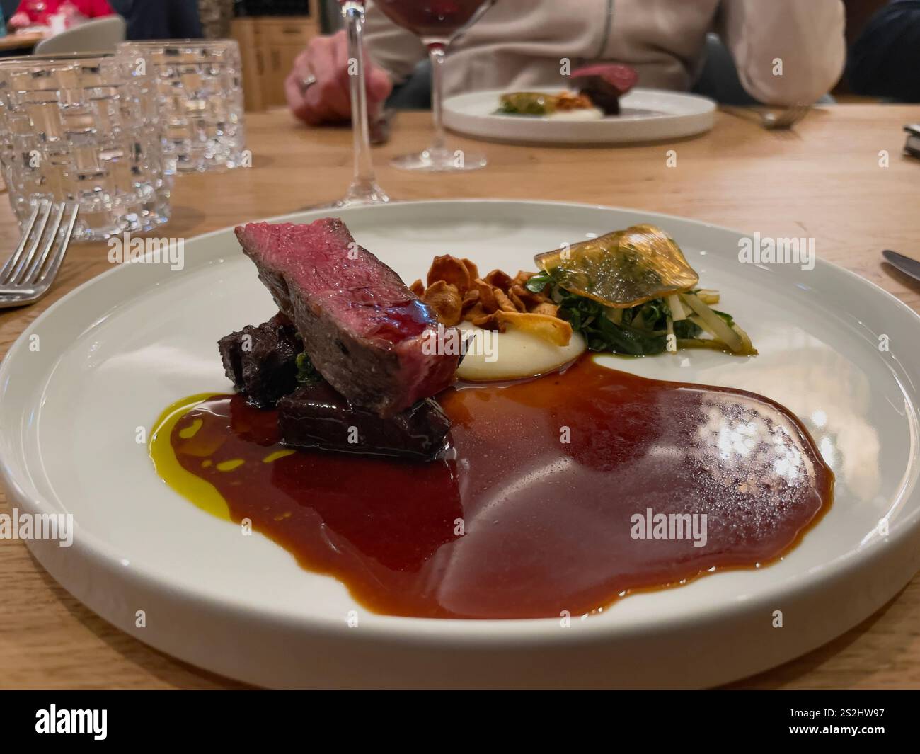 Exquisite gourmet dishes elegantly presented in a fine dining ...