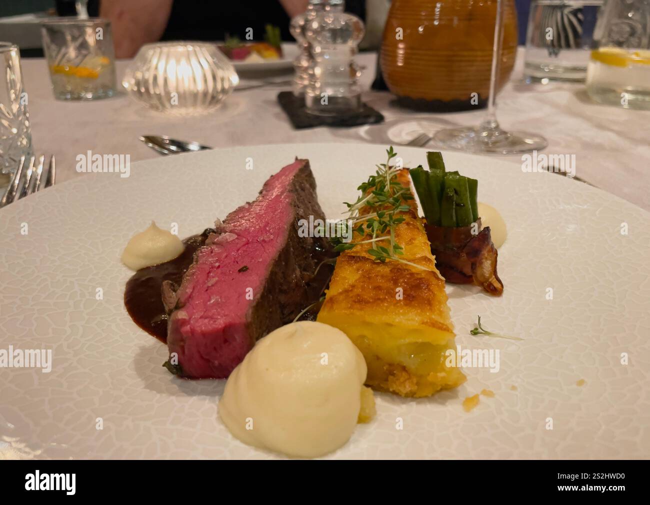 Exquisite gourmet dishes elegantly presented in a fine dining ...