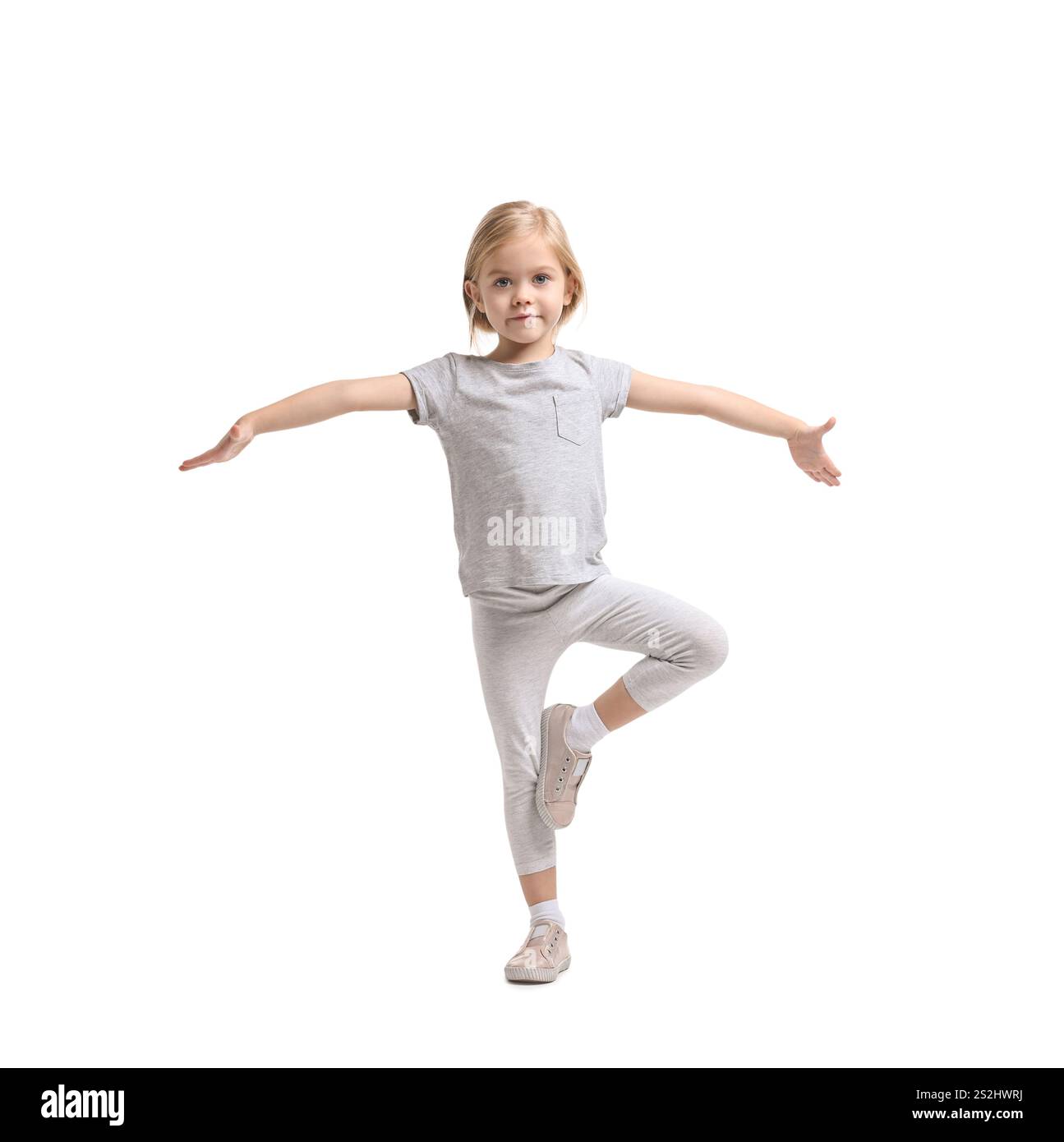 Little girl exercising on white background. Sport activity Stock Photo ...
