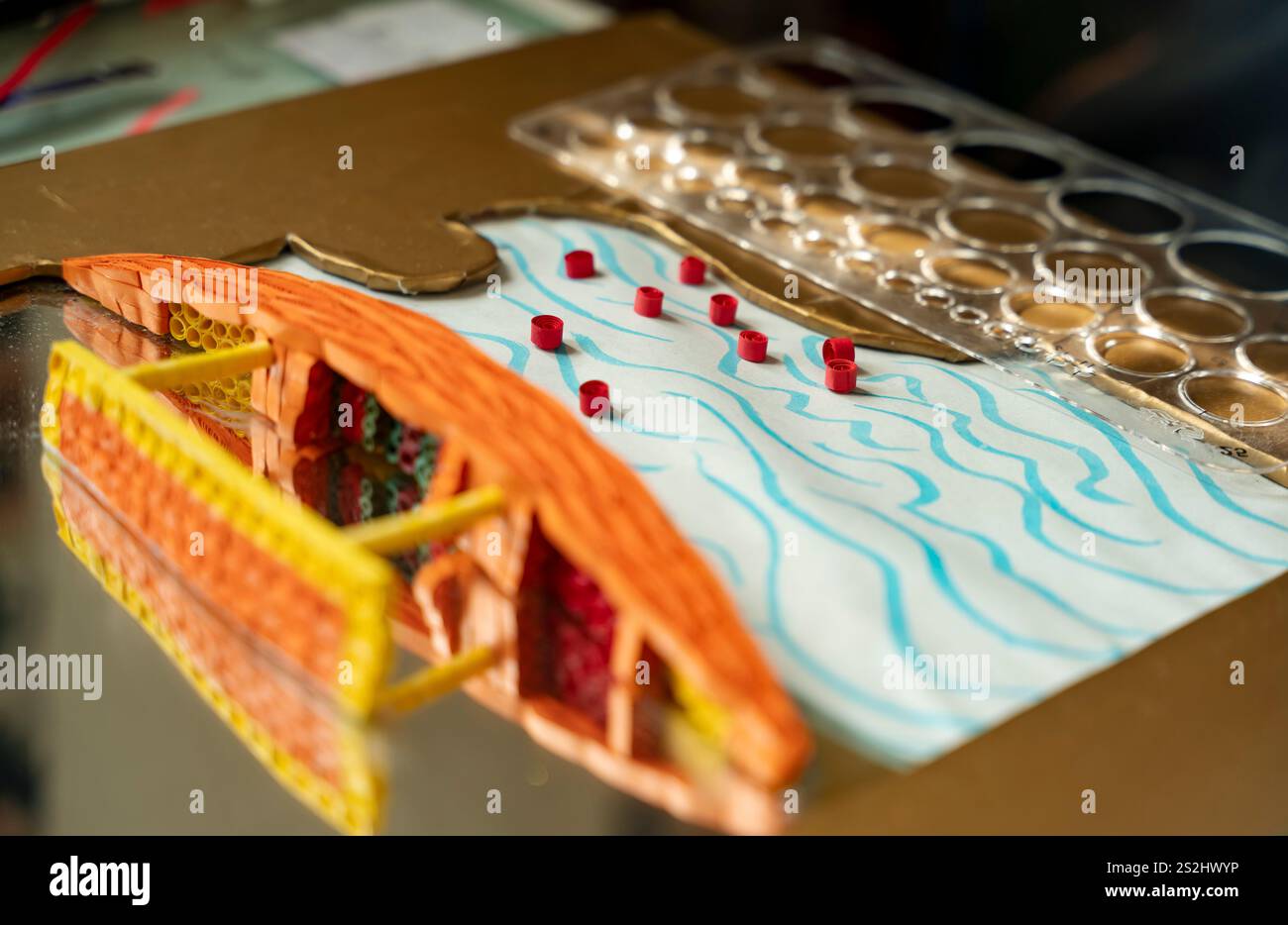 A shikara design crafted from quilling paper is seen at a home-based ...