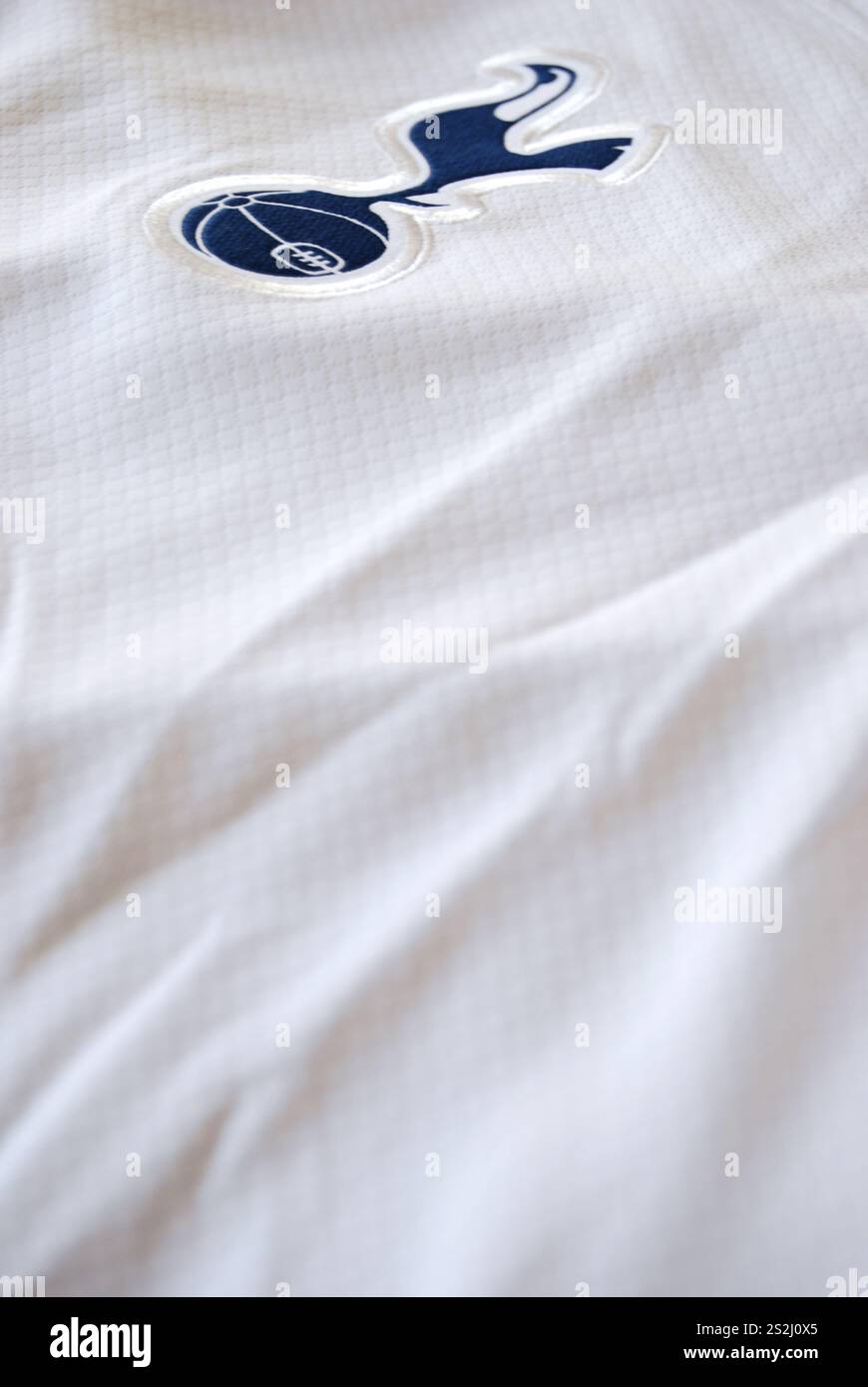 Angled close up photo of Tottenham Hotspur FC club badge on the shirt ...