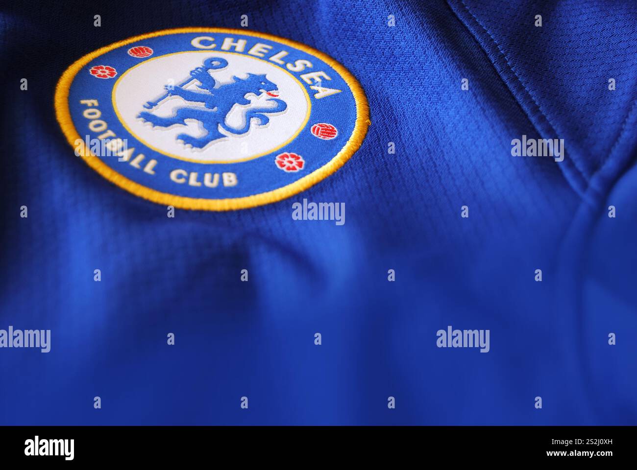 Angled close up photo of Chelsea FC club badge on the shirt with depth ...