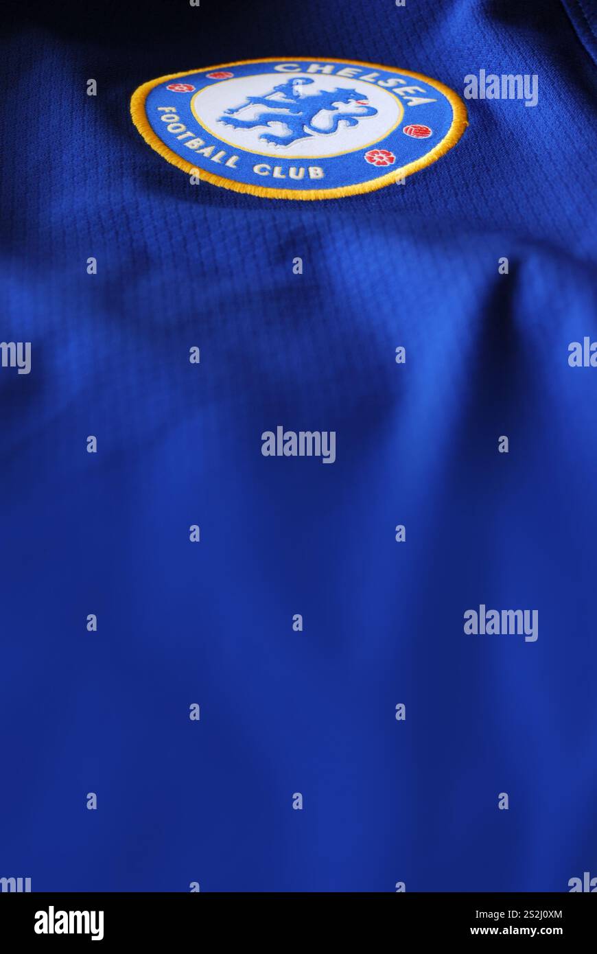 Angled close up photo of Chelsea FC club badge on the shirt with depth ...