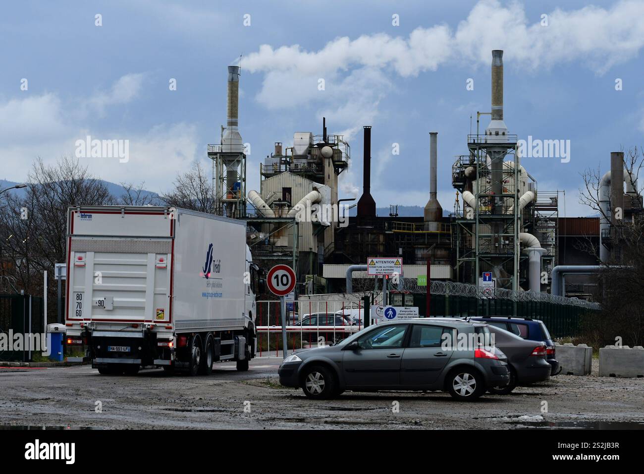 Transport truck and factories seen at the Roussillon chemical platform ...