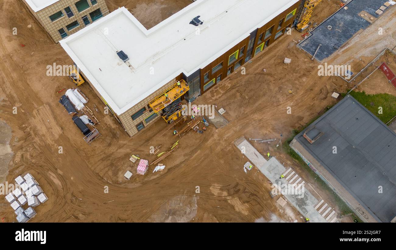 Aerial view of a construction site with a partially built building and ...