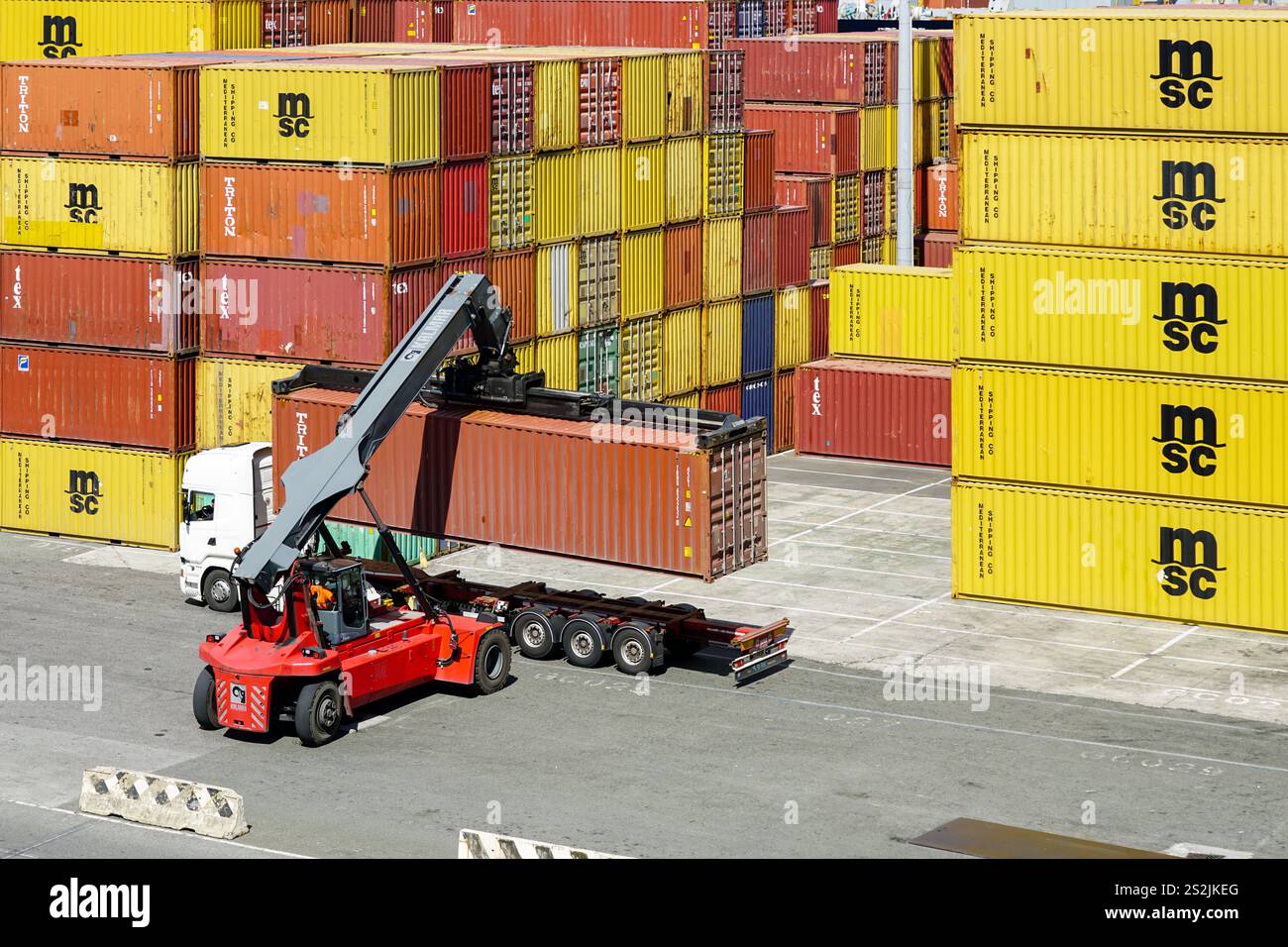 La Spezia, Italy - May 28, 2024: The forklift loads the cargo container ...