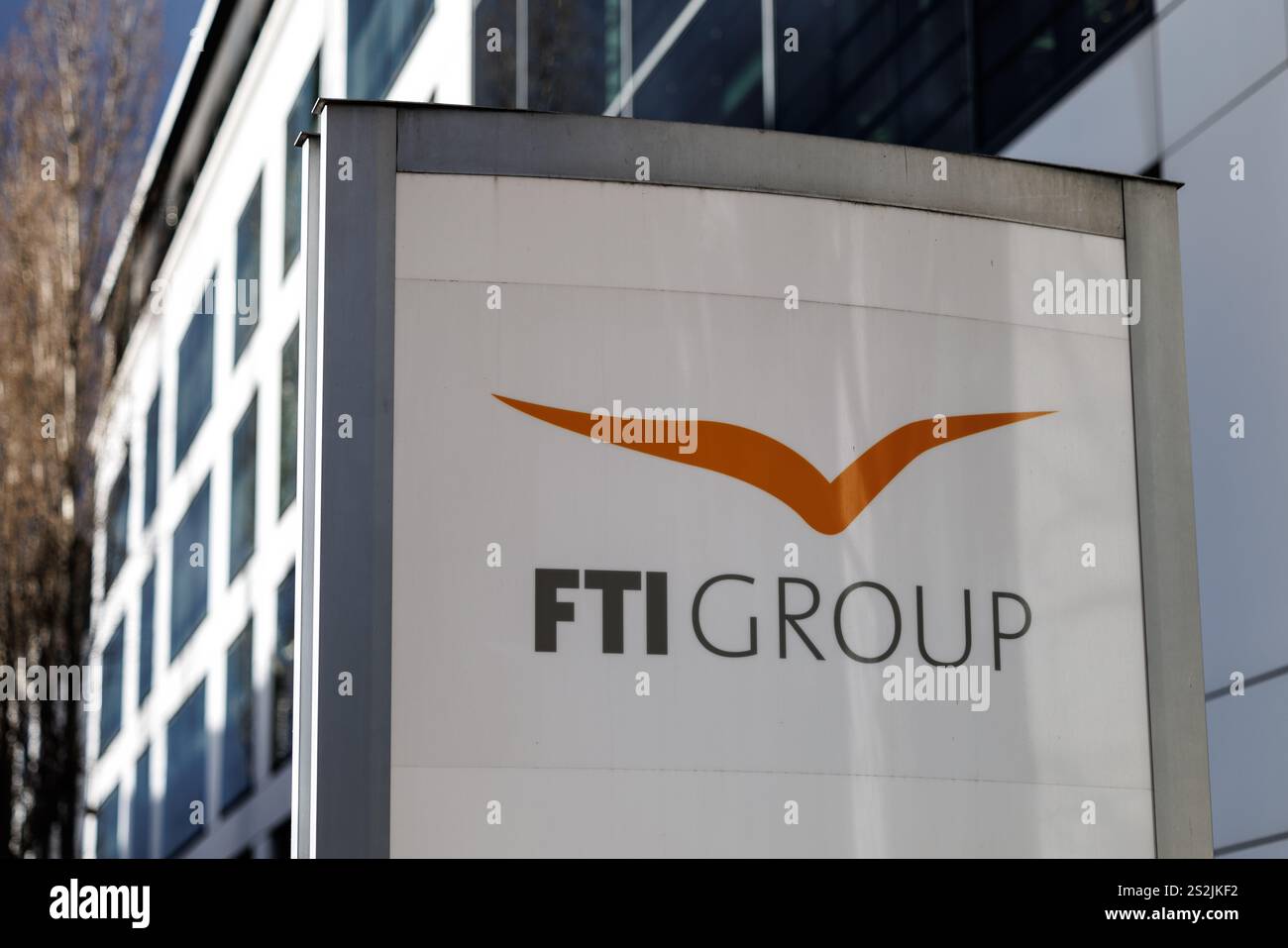 07 January 2025, Bavaria, Munich: The lettering "FTI Group" and the logo are on a stele in front ...