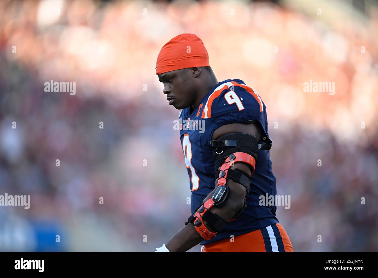 Illinois linebacker Seth Coleman (9) heads to the sideline after a play ...