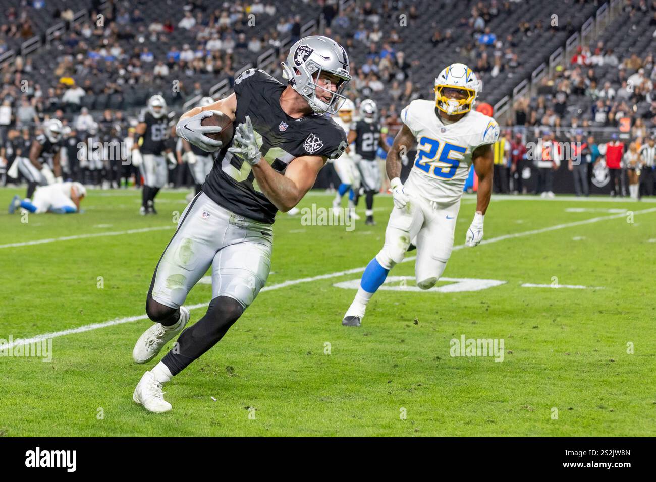 Las Vegas Raiders tight end Brock Bowers (89) catches a pass and runs ...