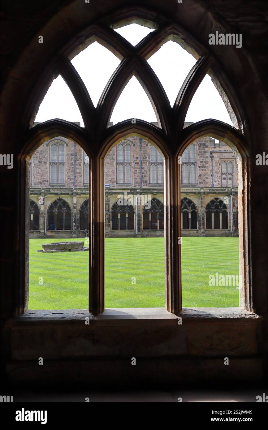 A view of the cloister, arched window and the inner courtyard of Durham ...