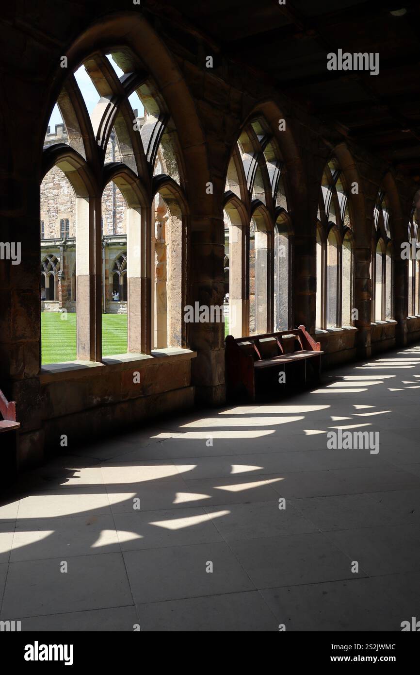 The play of light and shadows cast by arched windows in the inner ...